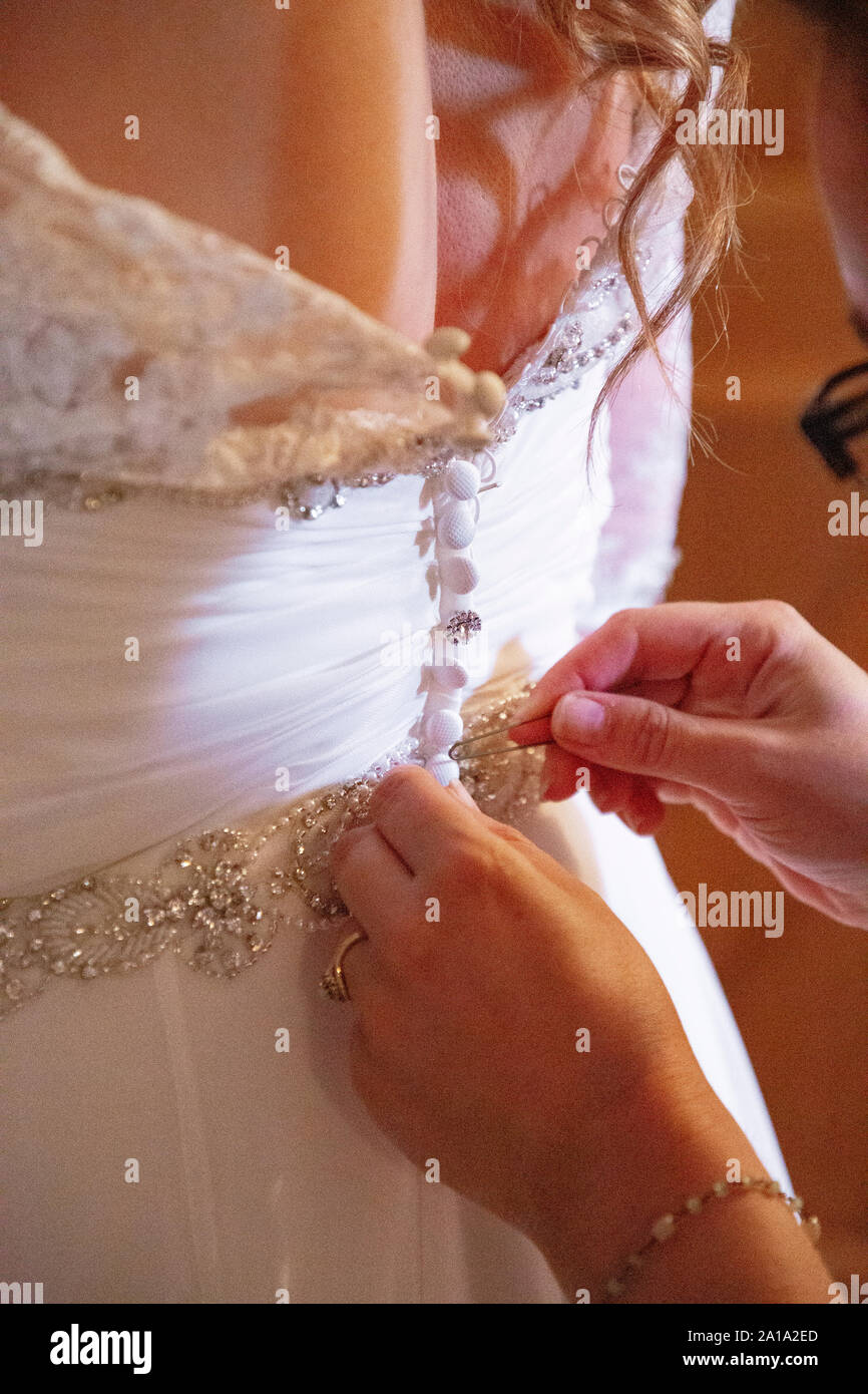 Doing up buttons hi-res stock photography and images - Alamy