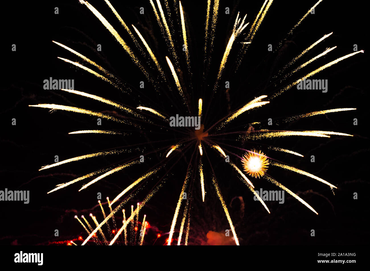 holiday celebration flash of colorful fireworks in the black night sky ...