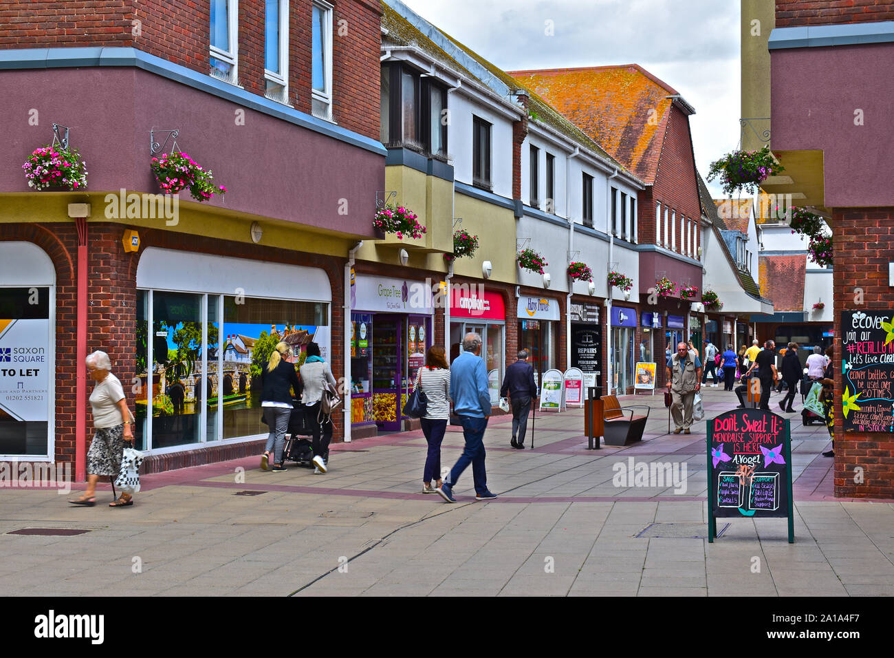 Shoppers enjoying strolling past the shops in Saxon Square, a modern ...