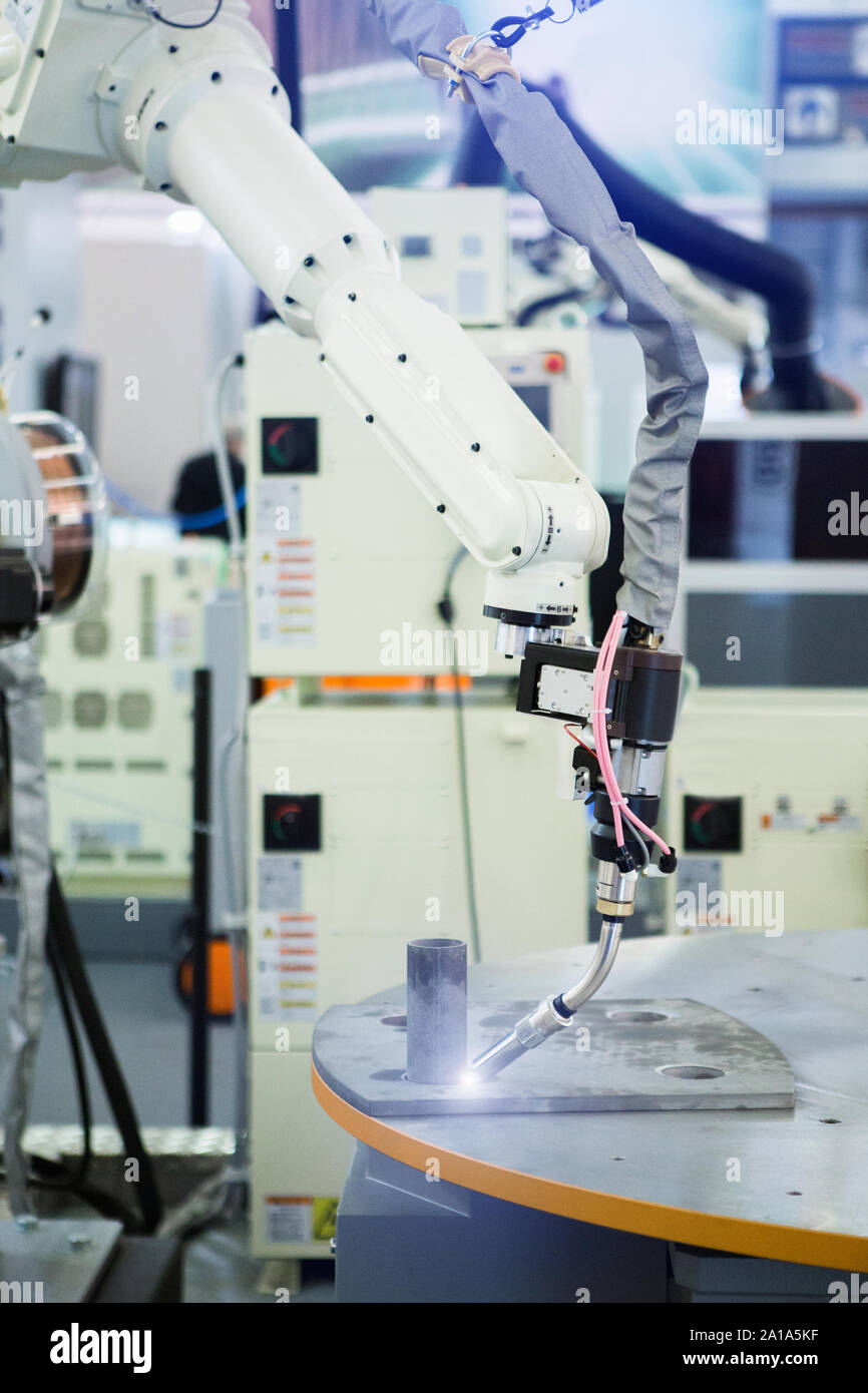 Automatic welding robot in a modern factory in operation Stock Photo ...
