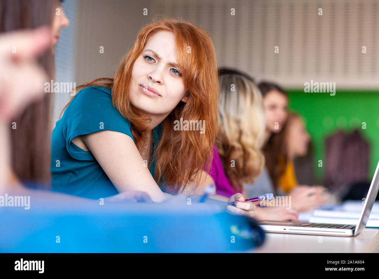 Group of female college students working on their homework/having a ...
