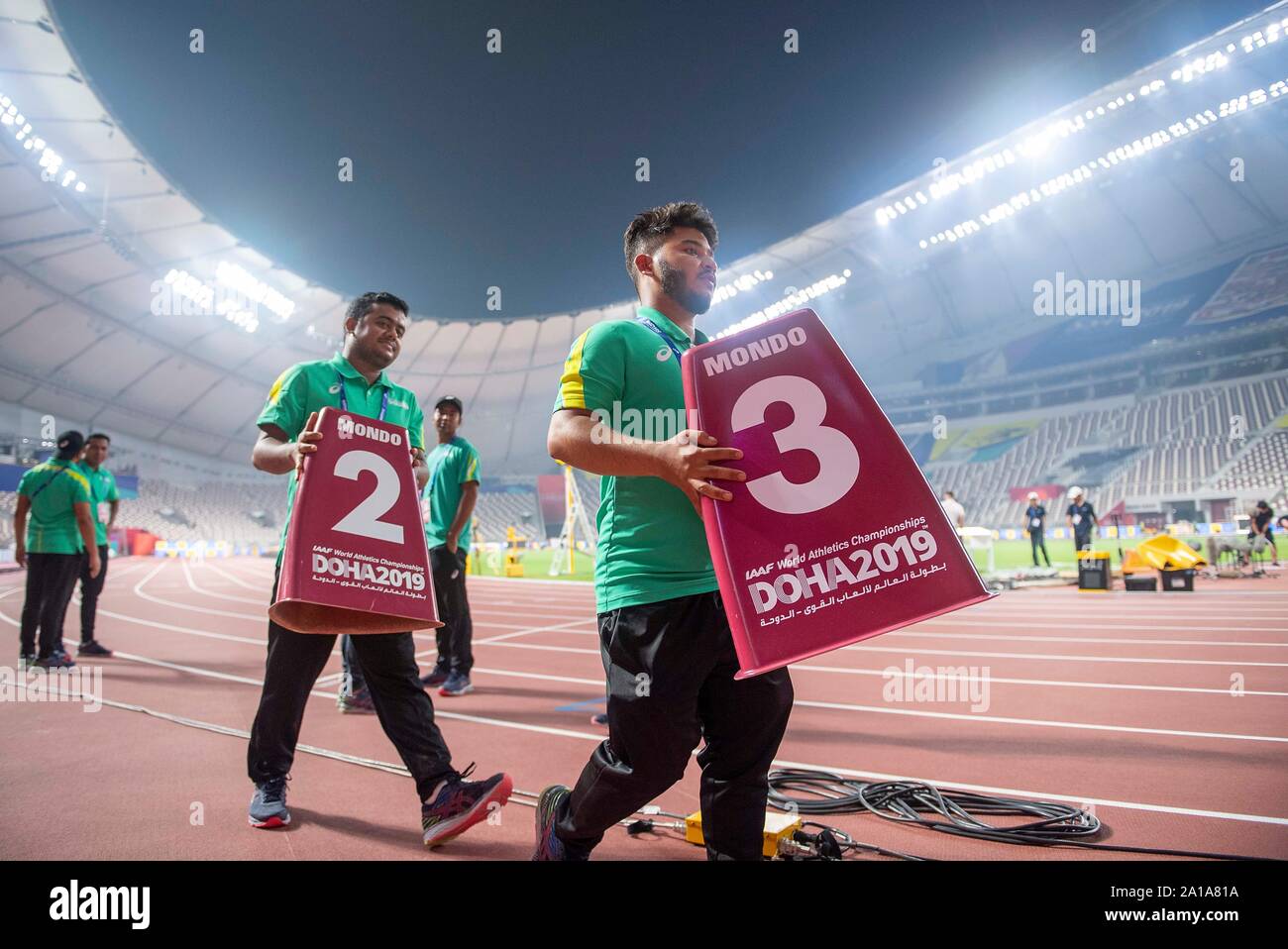 Feature, helpers carry starting blocks at Khalifa International Stadium ...