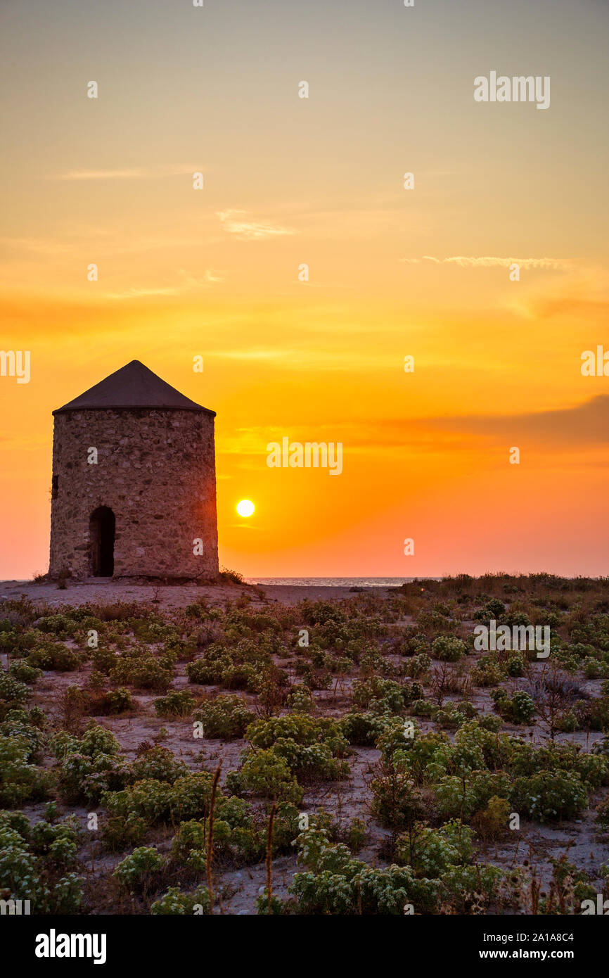 Beautiful sunset at Agios Ioannis (Gyra) beach which is famous for old ...