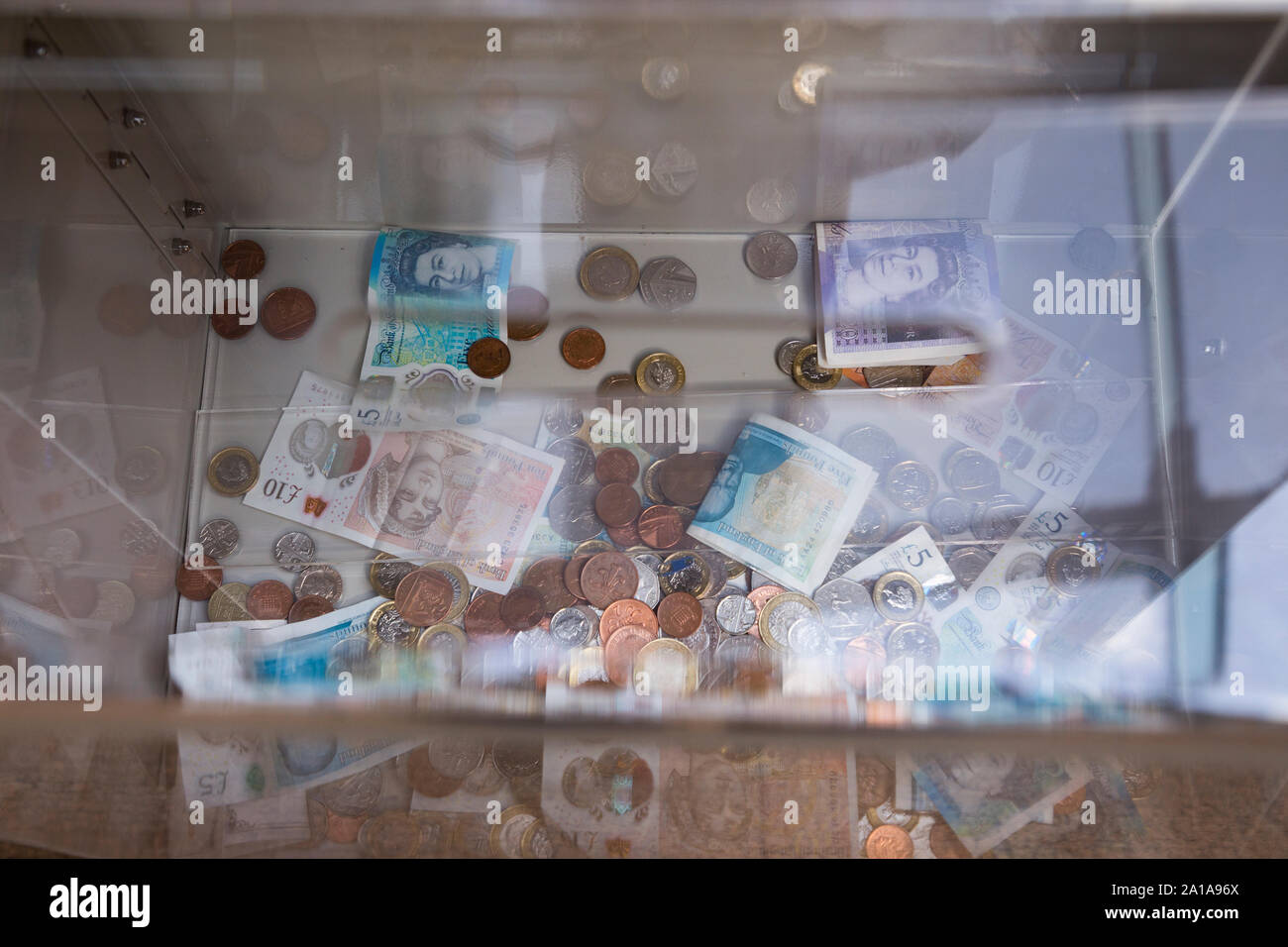 Donation charity britain coins hi-res stock photography and images - Alamy