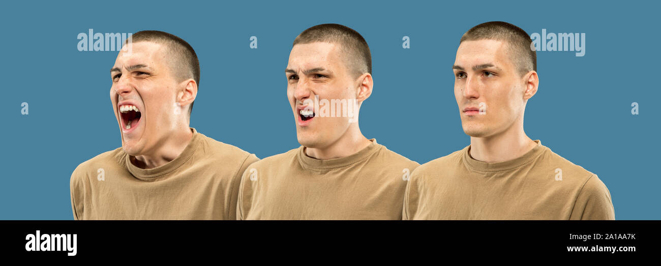 Caucasian young man's half-length portrait on blue studio background ...