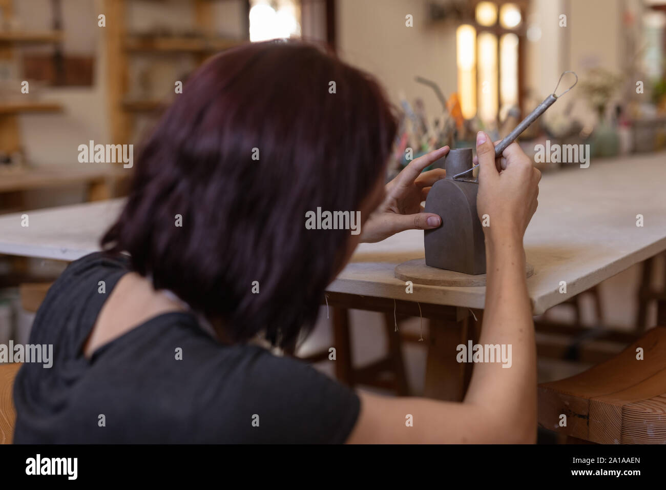 Female potter at work in a pottery studio Stock Photo - Alamy