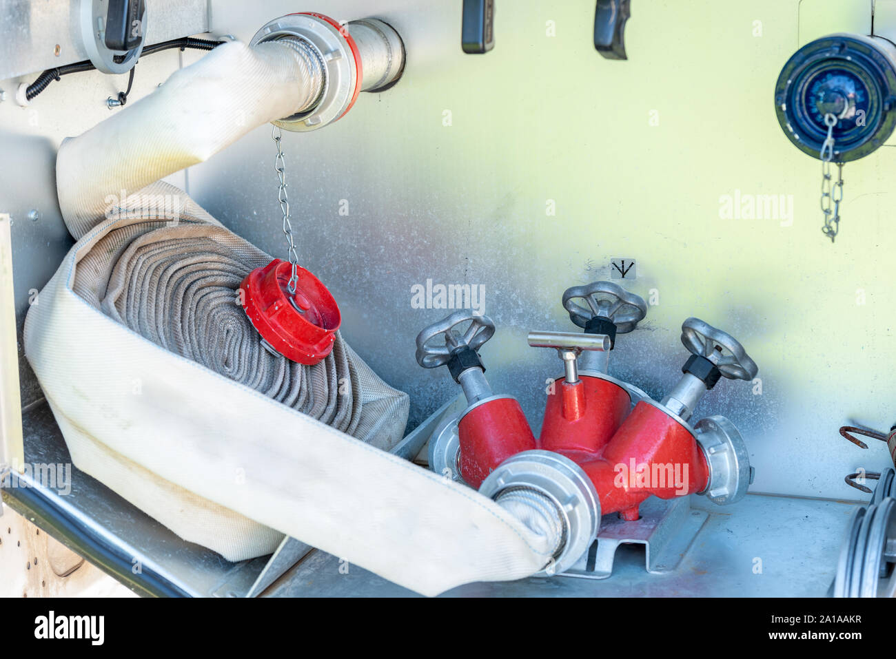 The side view of equipment packed neatly inside a fire engine, fire ...