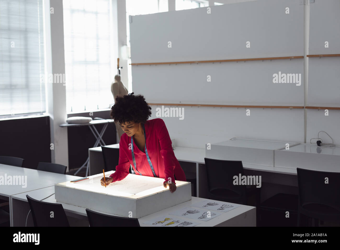 Female students working on a project at a fashion college Stock Photo ...