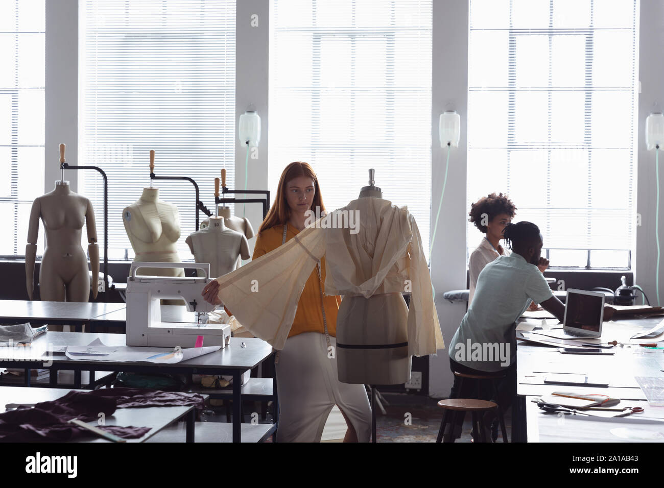 Female student working on a project at a fashion college Stock Photo ...