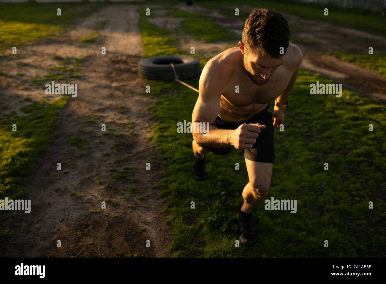Young man training at an outdoor gym bootcamp Stock Photo - Alamy