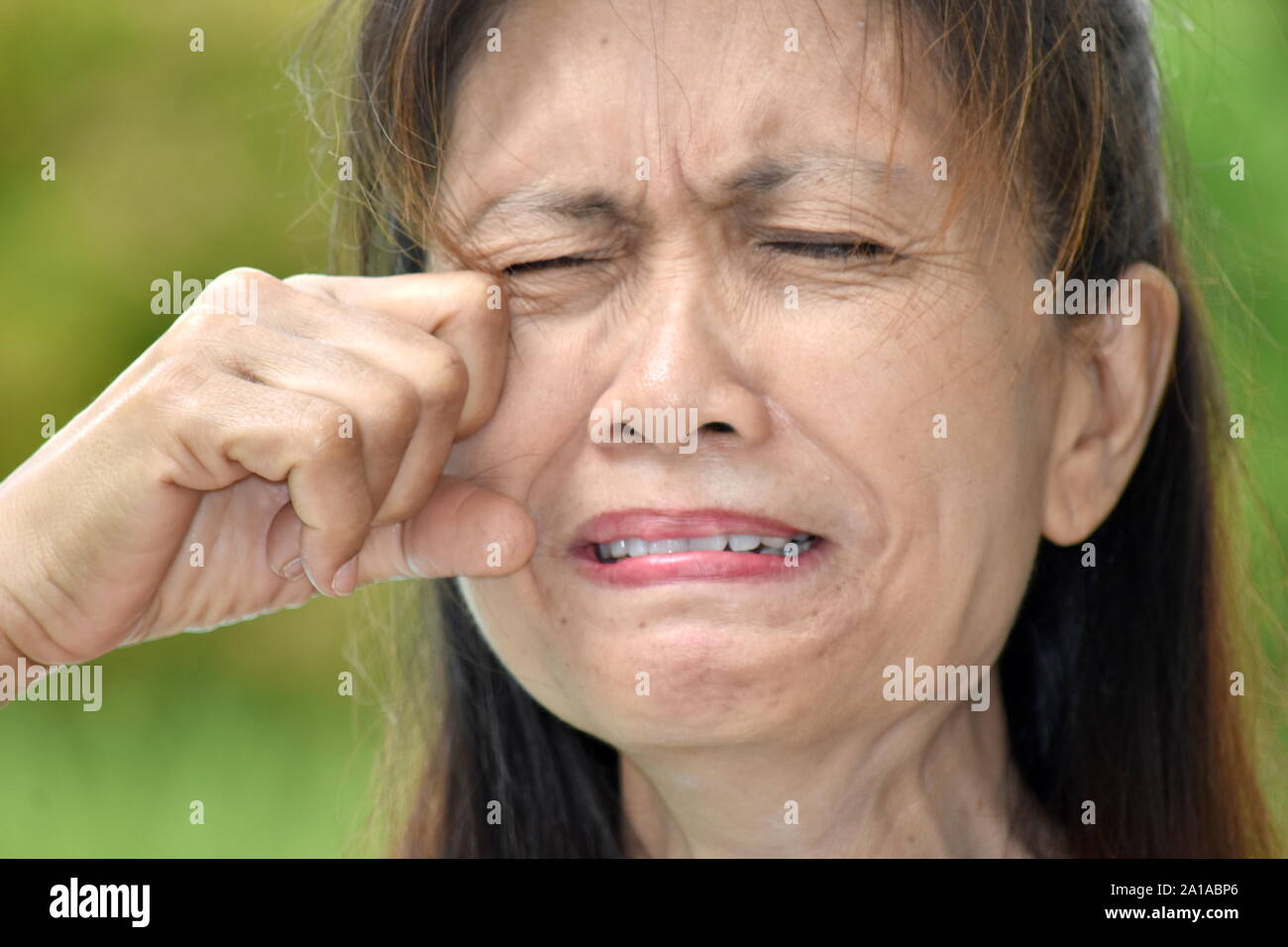 A Diverse Female Senior Crying Stock Photo - Alamy