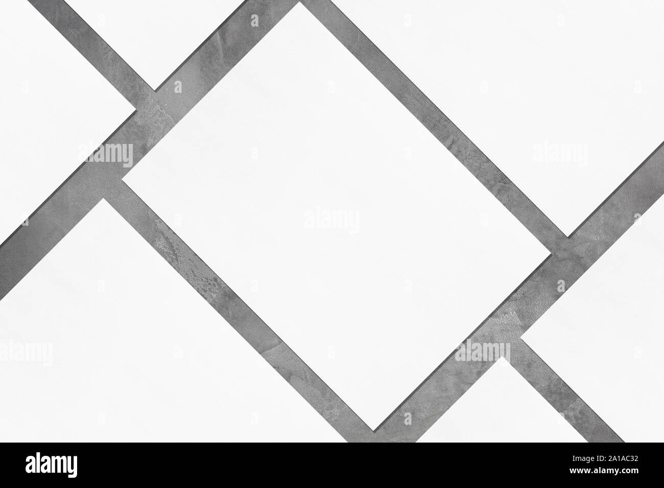 Closeup of empty white rectangle poster mockups lying diagonally with ...