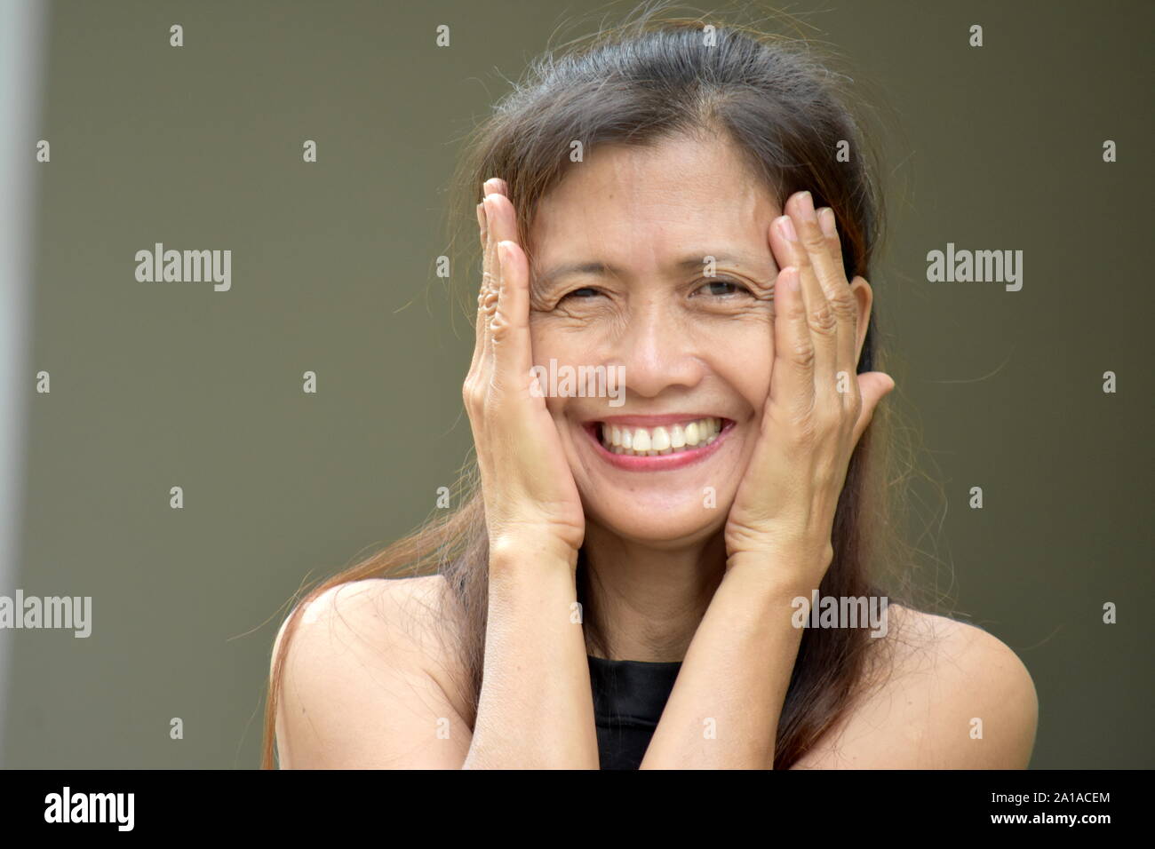 A Smiling Filipina Female Senior Stock Photo - Alamy