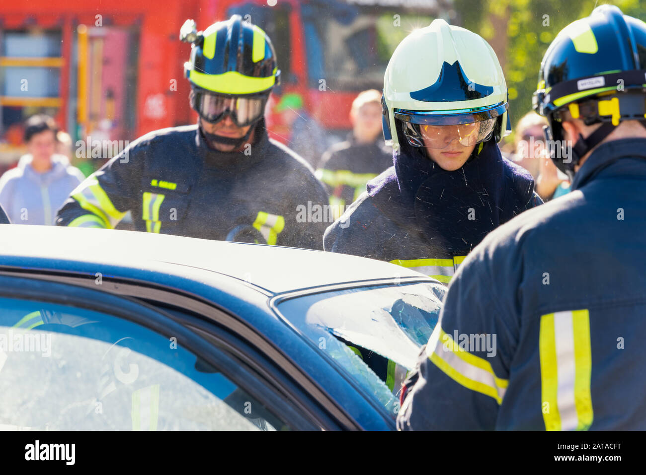 Firefighters, fireman cut a car glass and door in car accident Stock ...