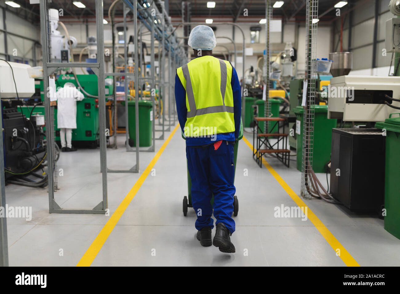 Male factory worker in a factory warehouse Stock Photo - Alamy