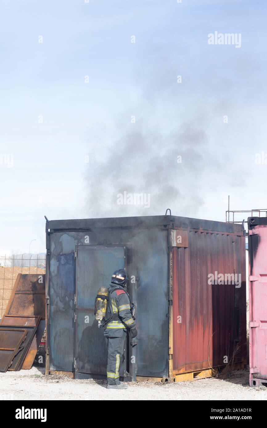 Firefighter putting out fire training station extinguisher backdraft ...