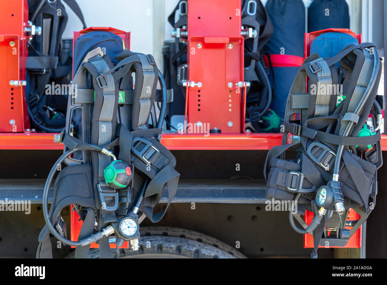 The side view of equipment packed neatly inside a fire engine, fire ...