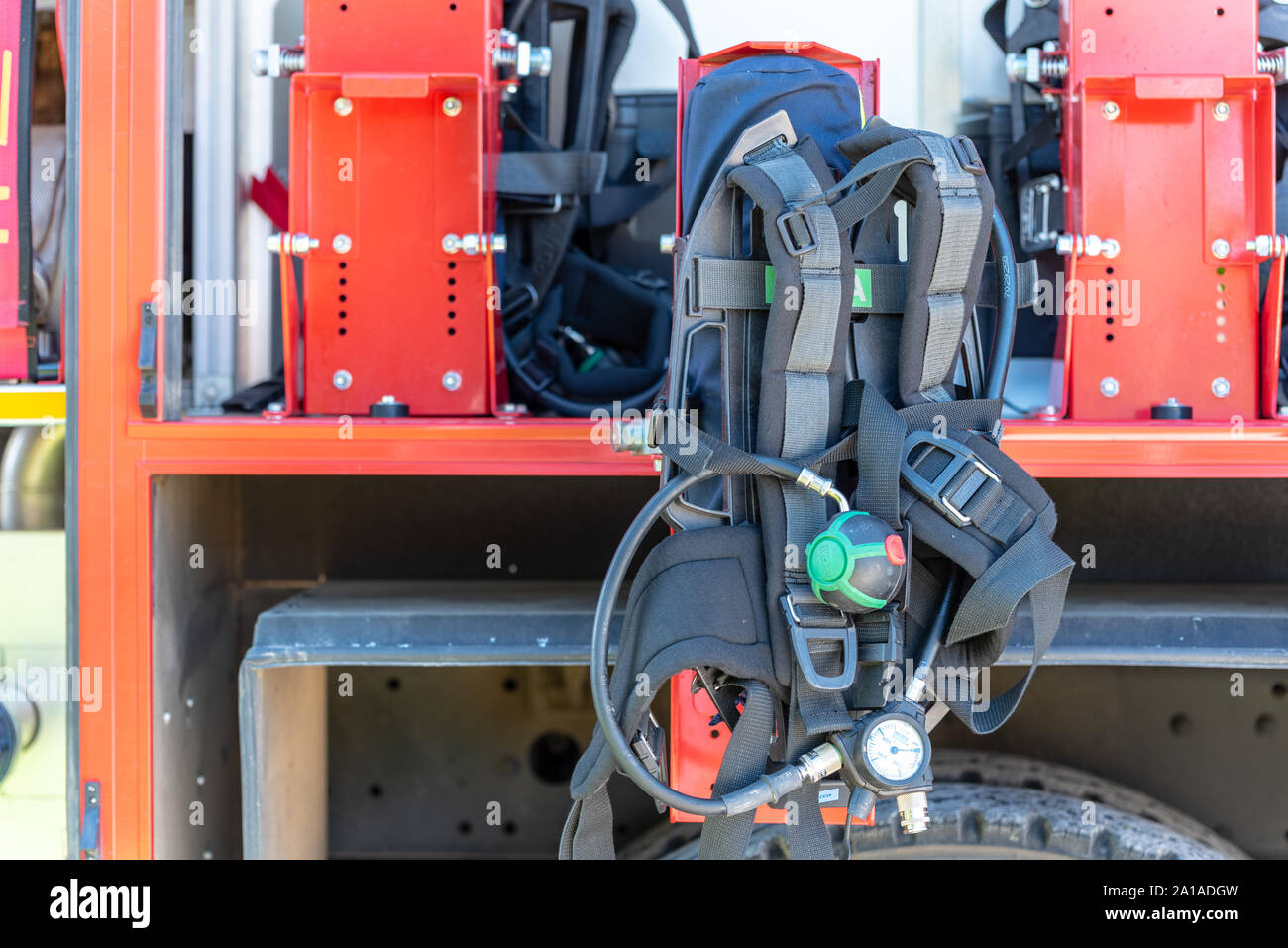 The side view of equipment packed neatly inside a fire engine, fire ...