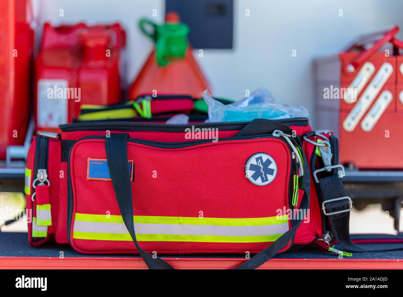 First aid kit an open red first aid kit bag with a black zip and handle ...