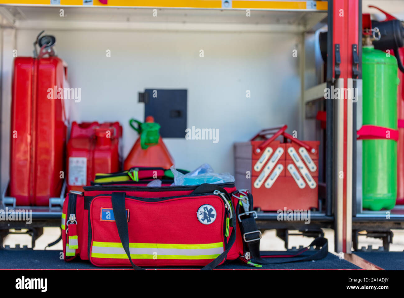 First aid kit an open red first aid kit bag with a black zip and handle ...