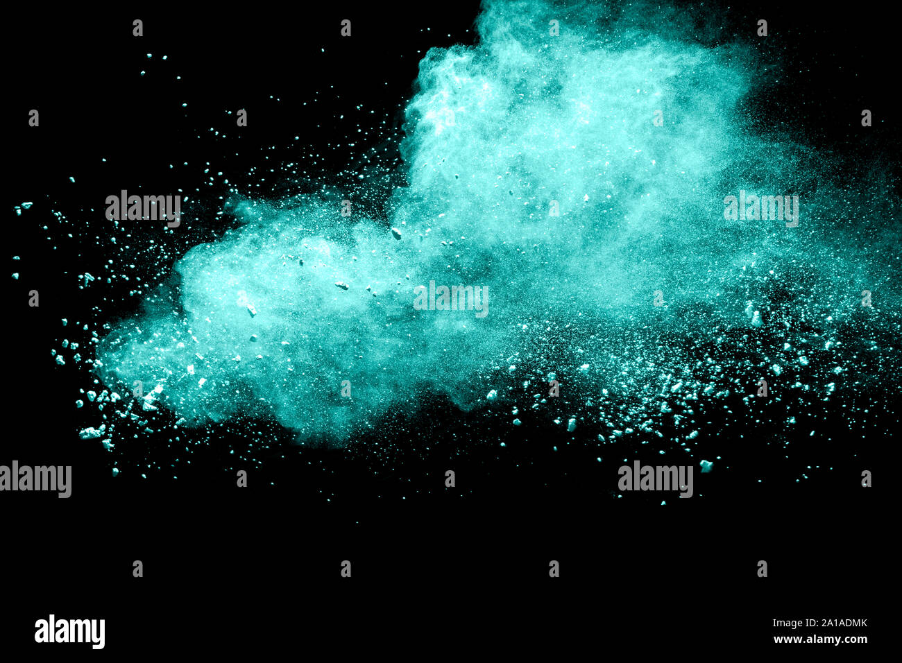 Green color powder explosion cloud on black background.Green dust ...
