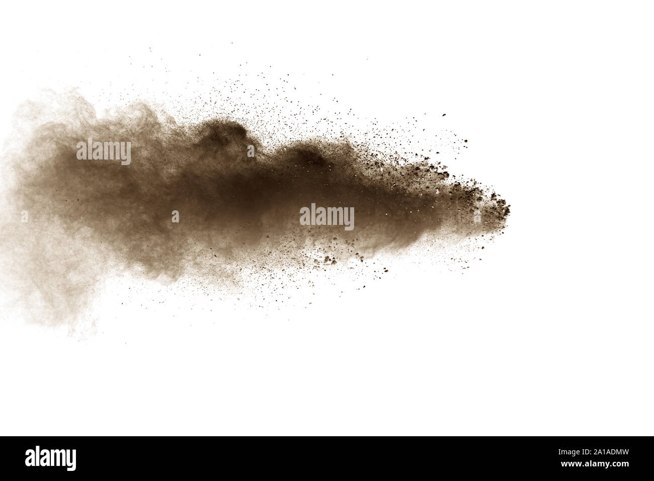 Abstract deep brown dust explosion on white background. Freeze motion ...