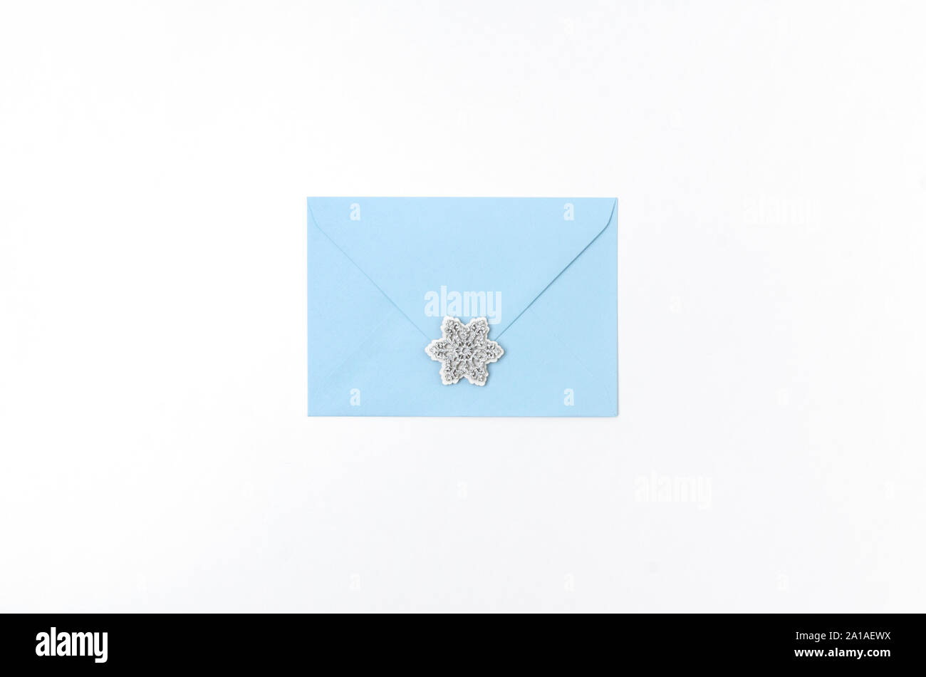 Blue envelope with snowflakes isolated on white background Stock Photo ...