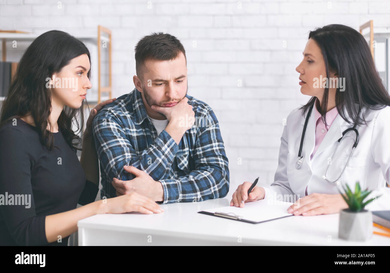 Upset thoughtful man heard bad diagnosys, listening to doctor at clinic ...