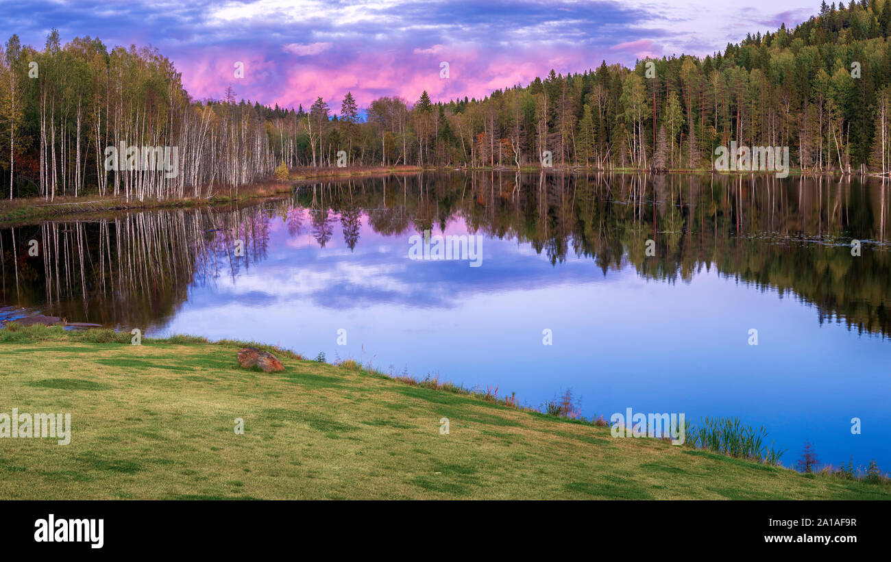 Idyllic sunset on the lake. Romantic ecological tourism Stock Photo - Alamy