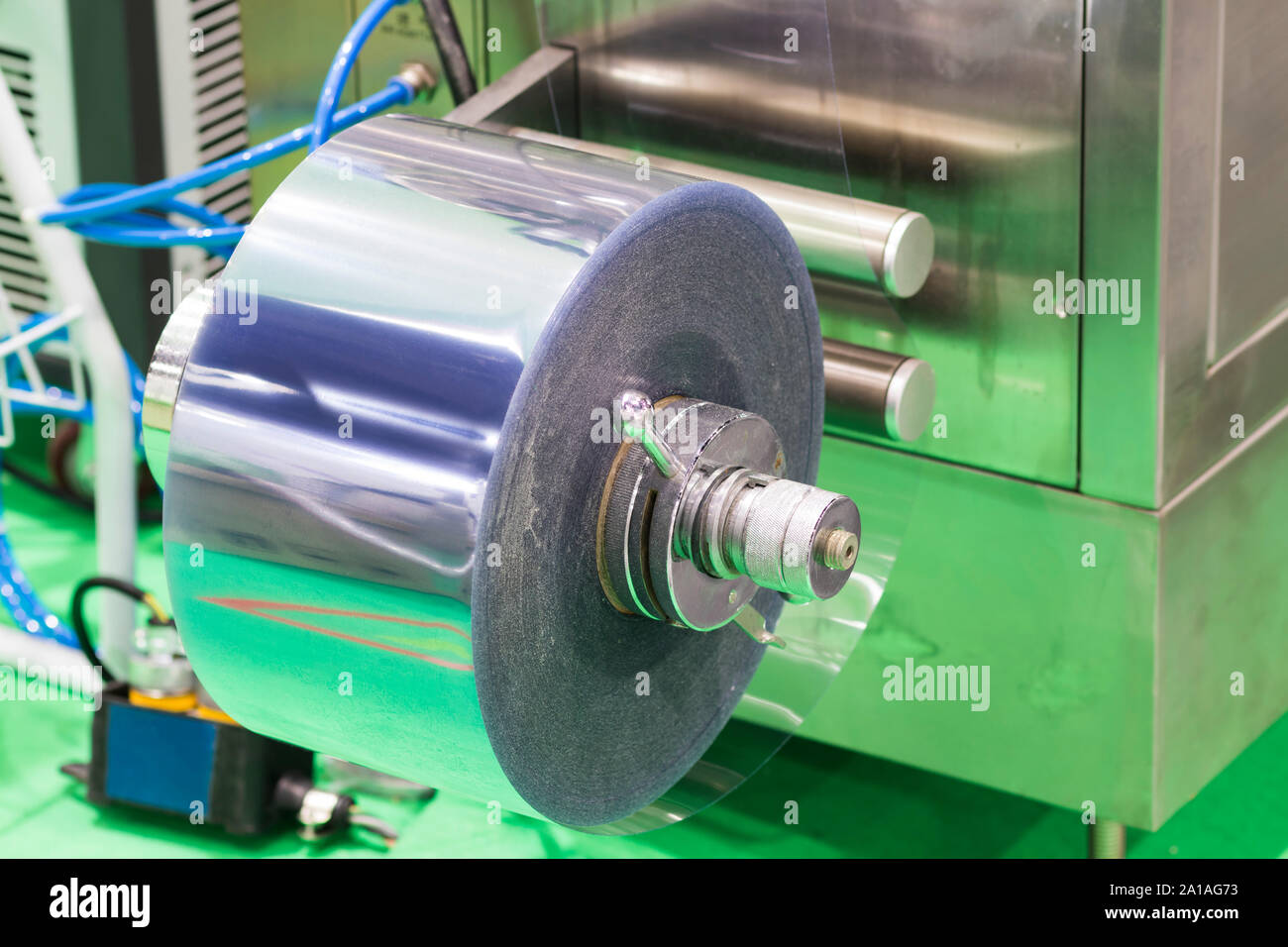 Roll of plastic for capsules packing machine ; process Stock Photo - Alamy
