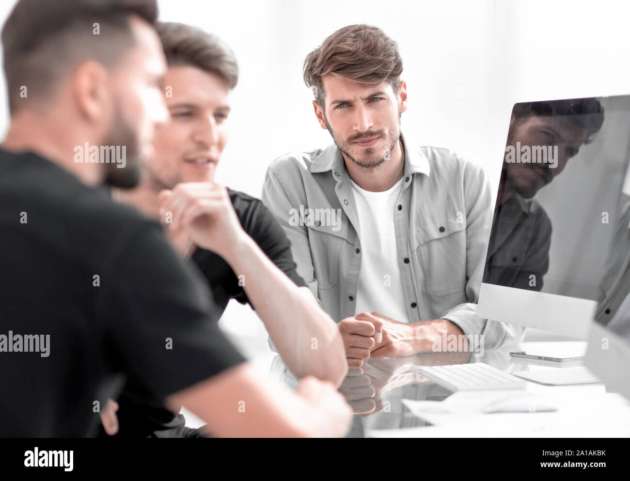 Beautiful business people are using computers while working in office ...