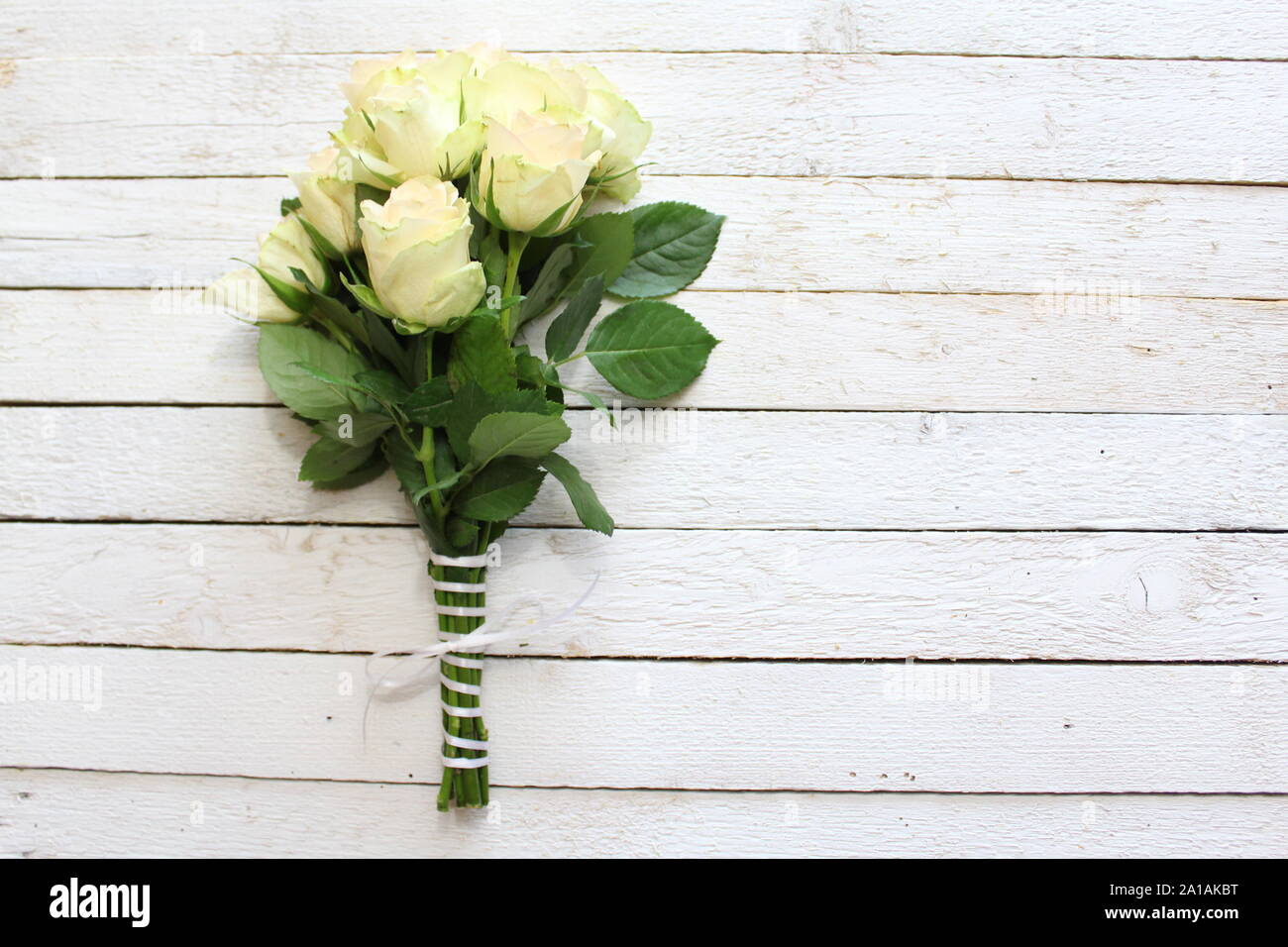 The picture shows white roses on wooden boards Stock Photo - Alamy