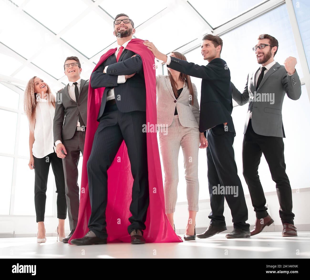 boss is a superhero and the business team is standing together Stock ...