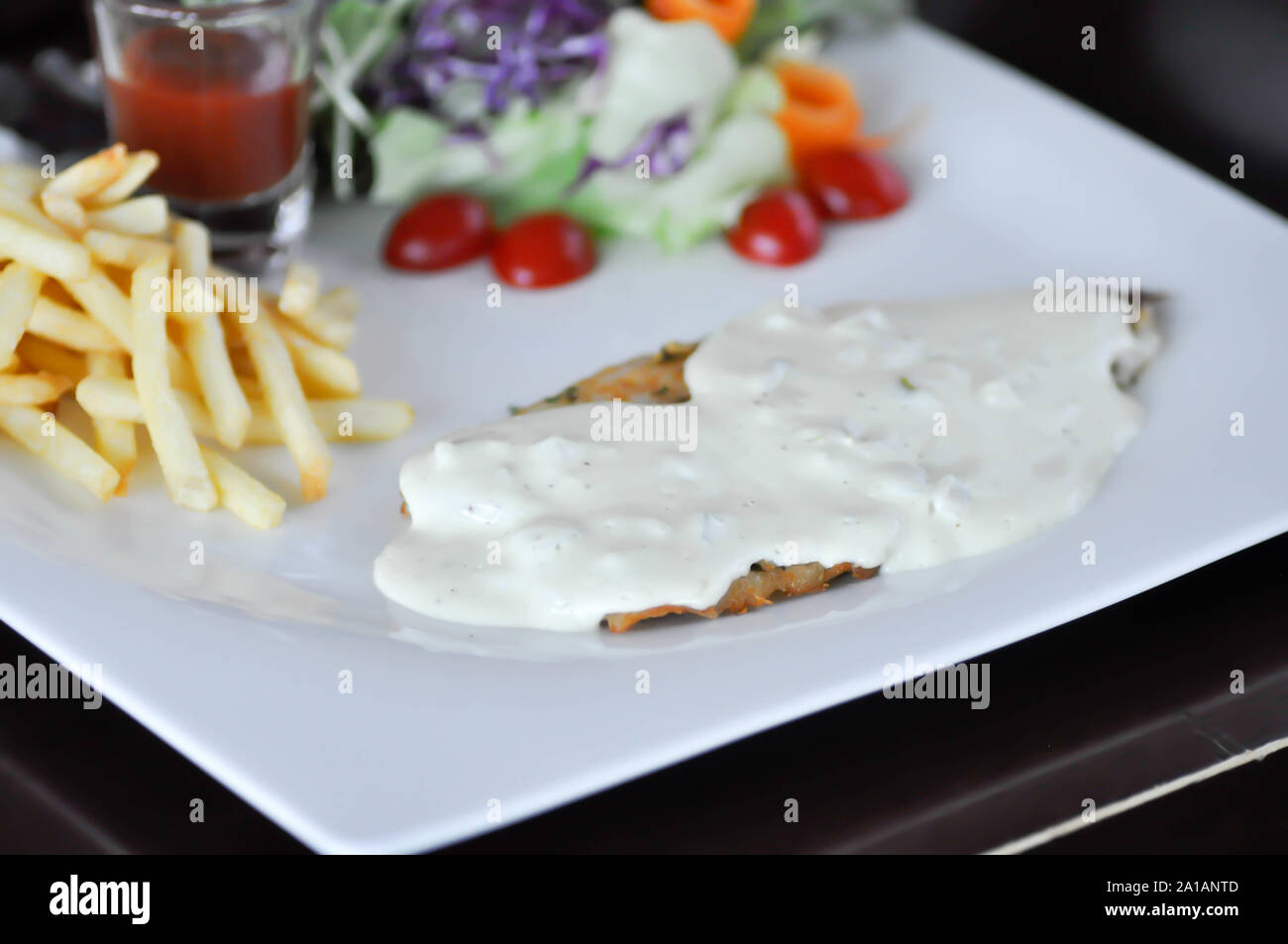 fish steak , catfish steak with white cream sauce topping Stock Photo ...