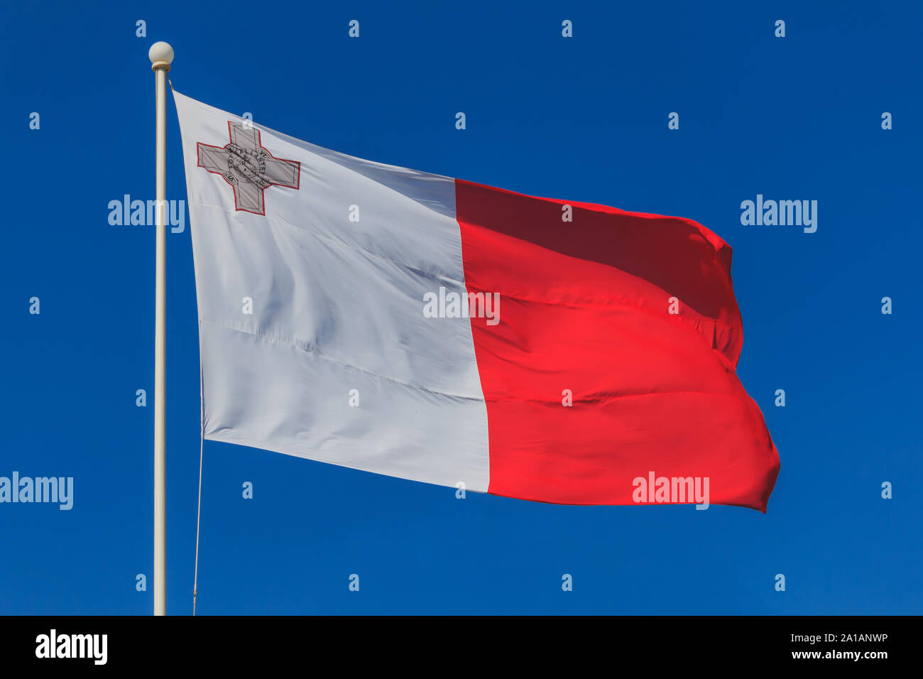 Malta national flag is waving in deep blue sky background Stock Photo ...