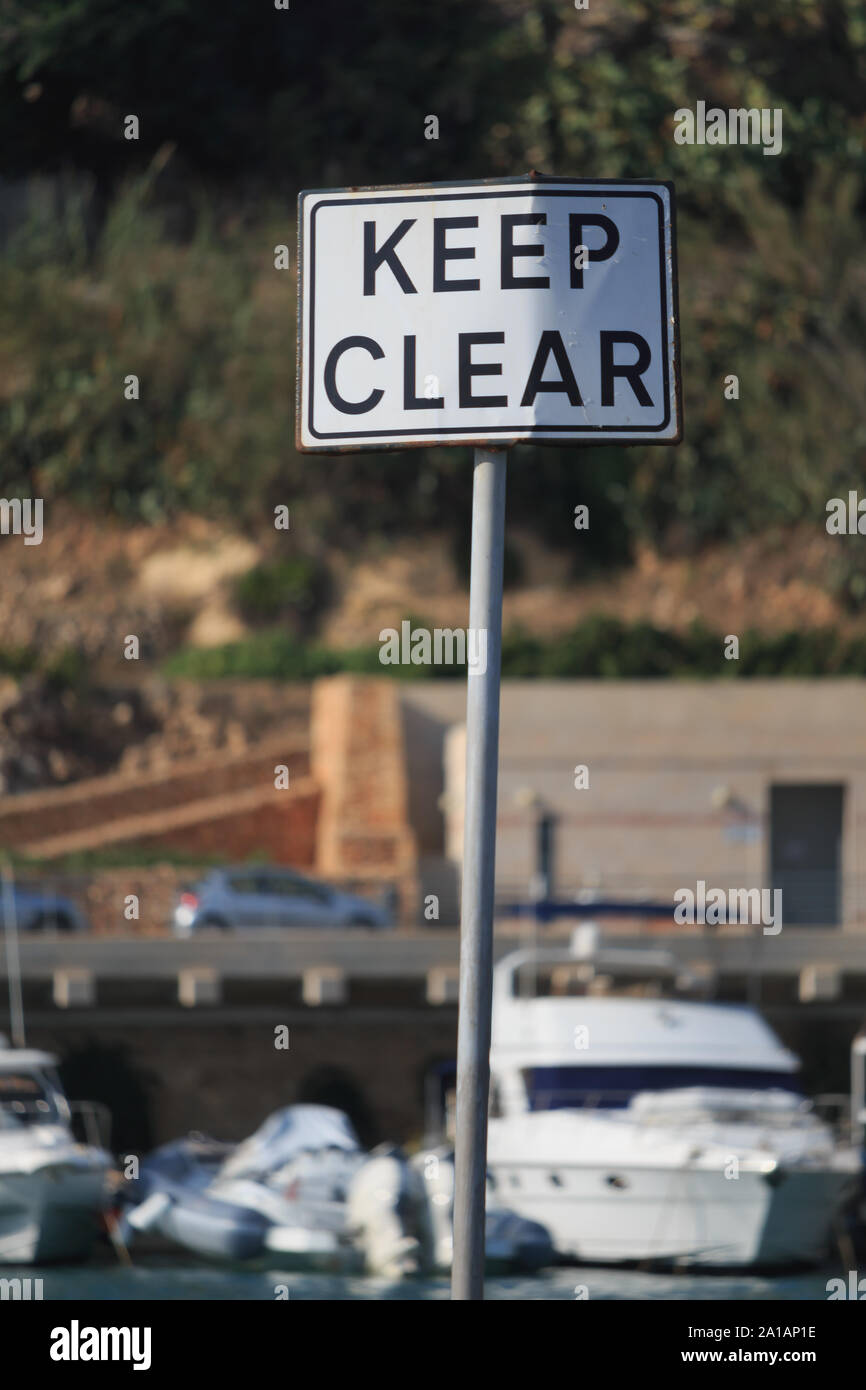 Keep clear road sign on blur background, vertical Stock Photo - Alamy