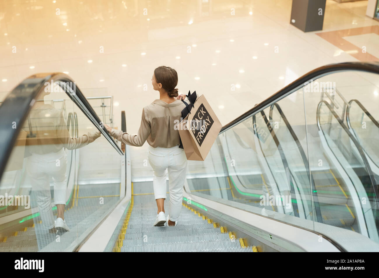 Woman standing looking down, rear view hi-res stock photography and ...