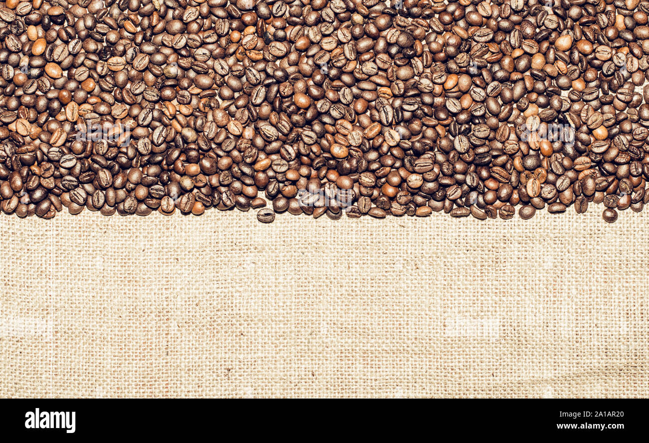 texture whole fried grains, coffee on rough fabric Stock Photo - Alamy