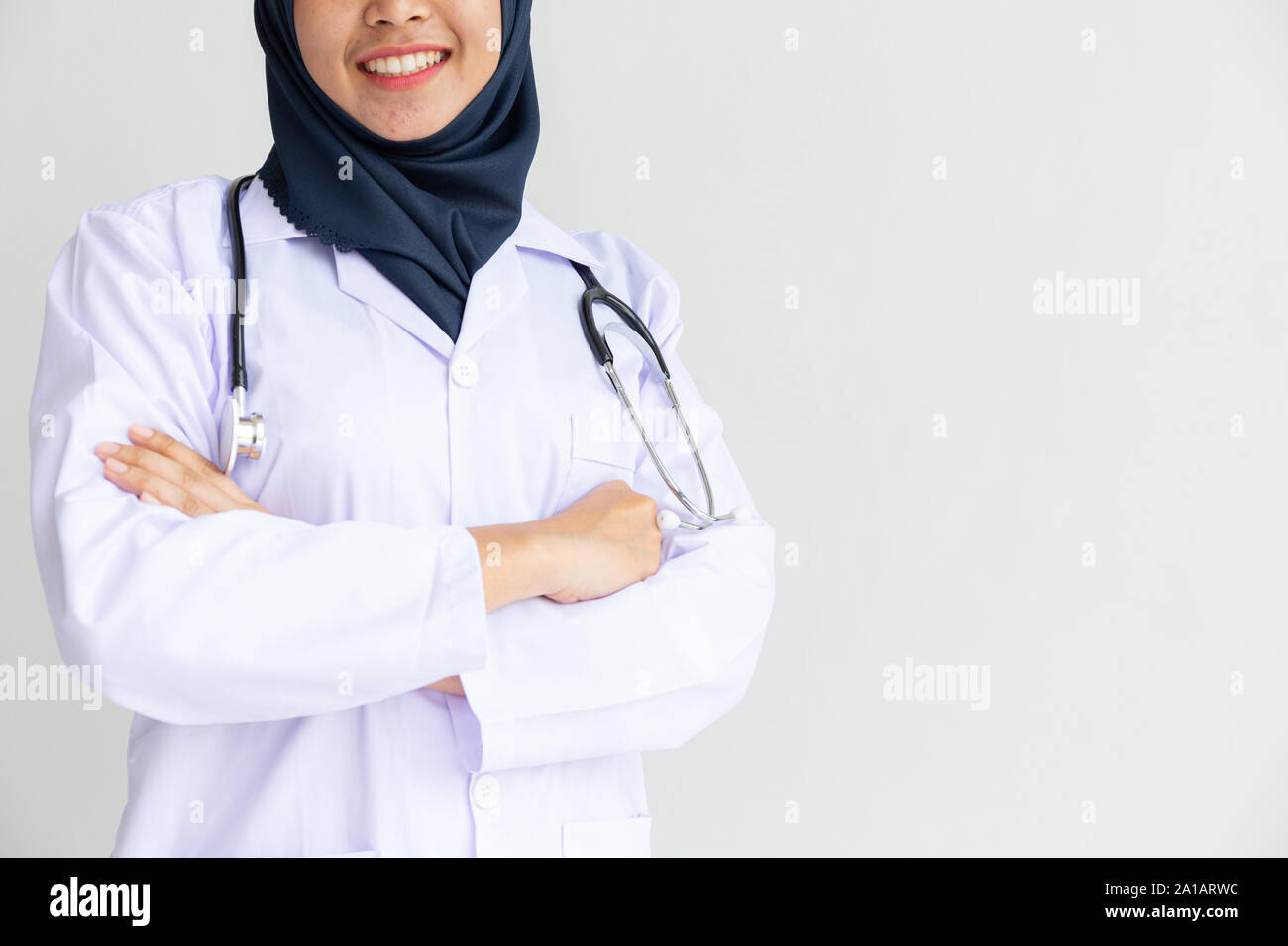 Young Arab Muslim intern doctor women smile on isolate white background ...