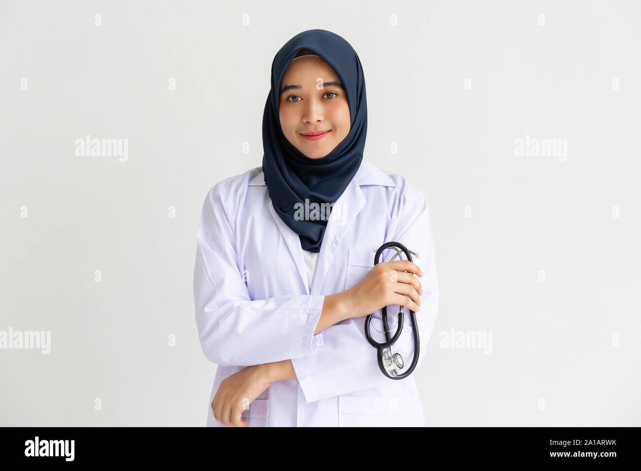 Young Arab Muslim intern doctor women smile on isolate white background ...
