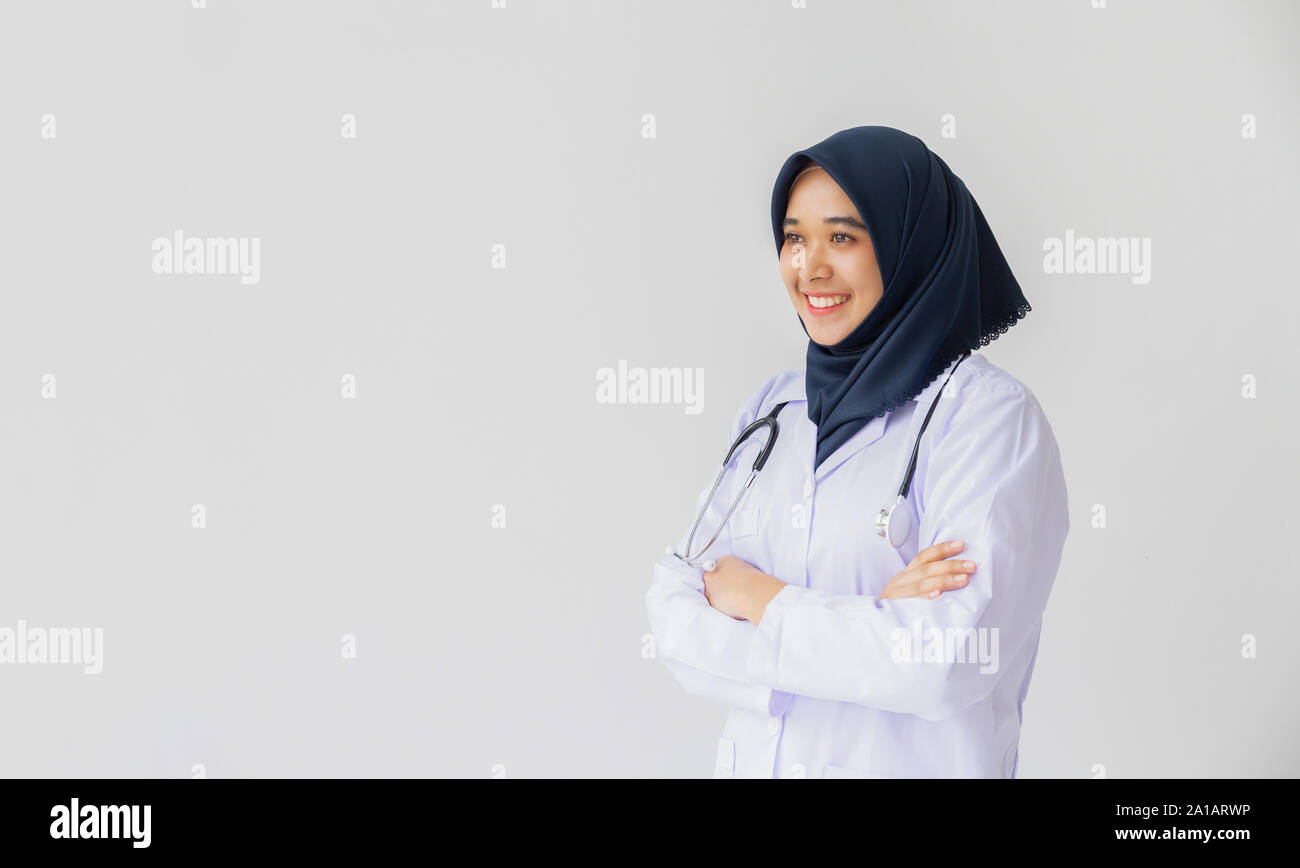 Young Arab Muslim intern doctor women smile on isolate white background ...