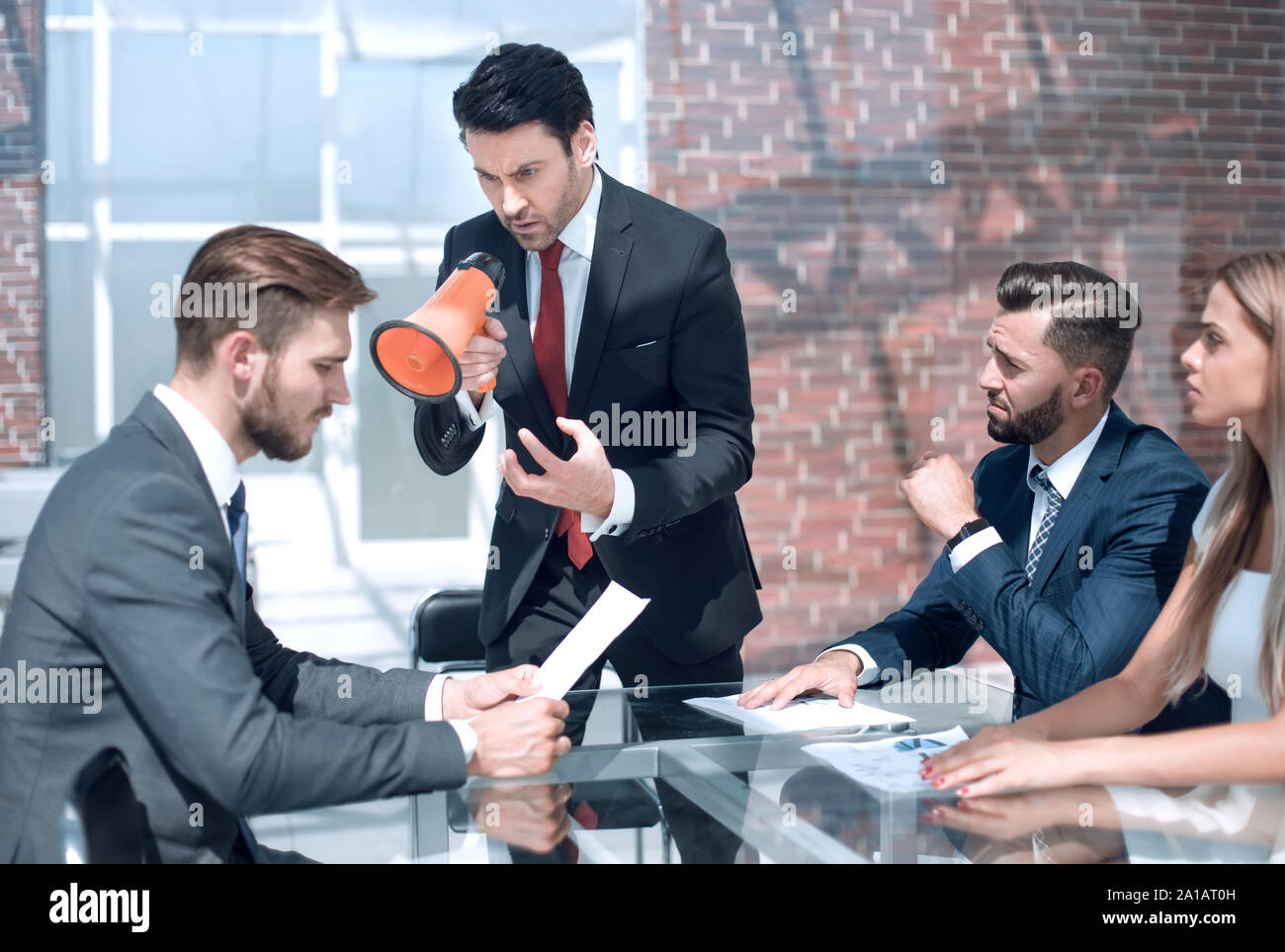 boss screams through the megaphone in the office Stock Photo - Alamy