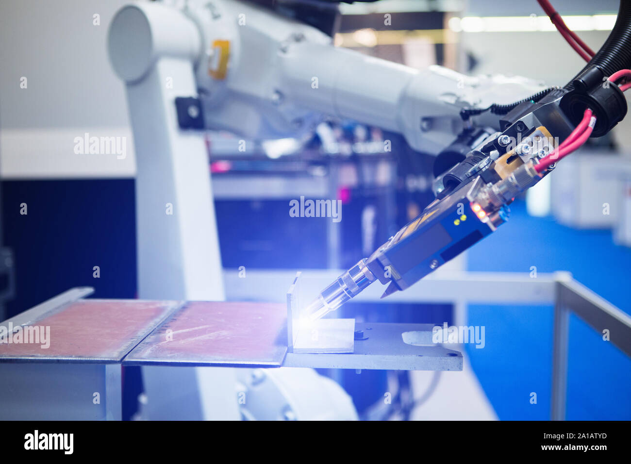 Automatic welding robot in a modern factory in operation Stock Photo ...