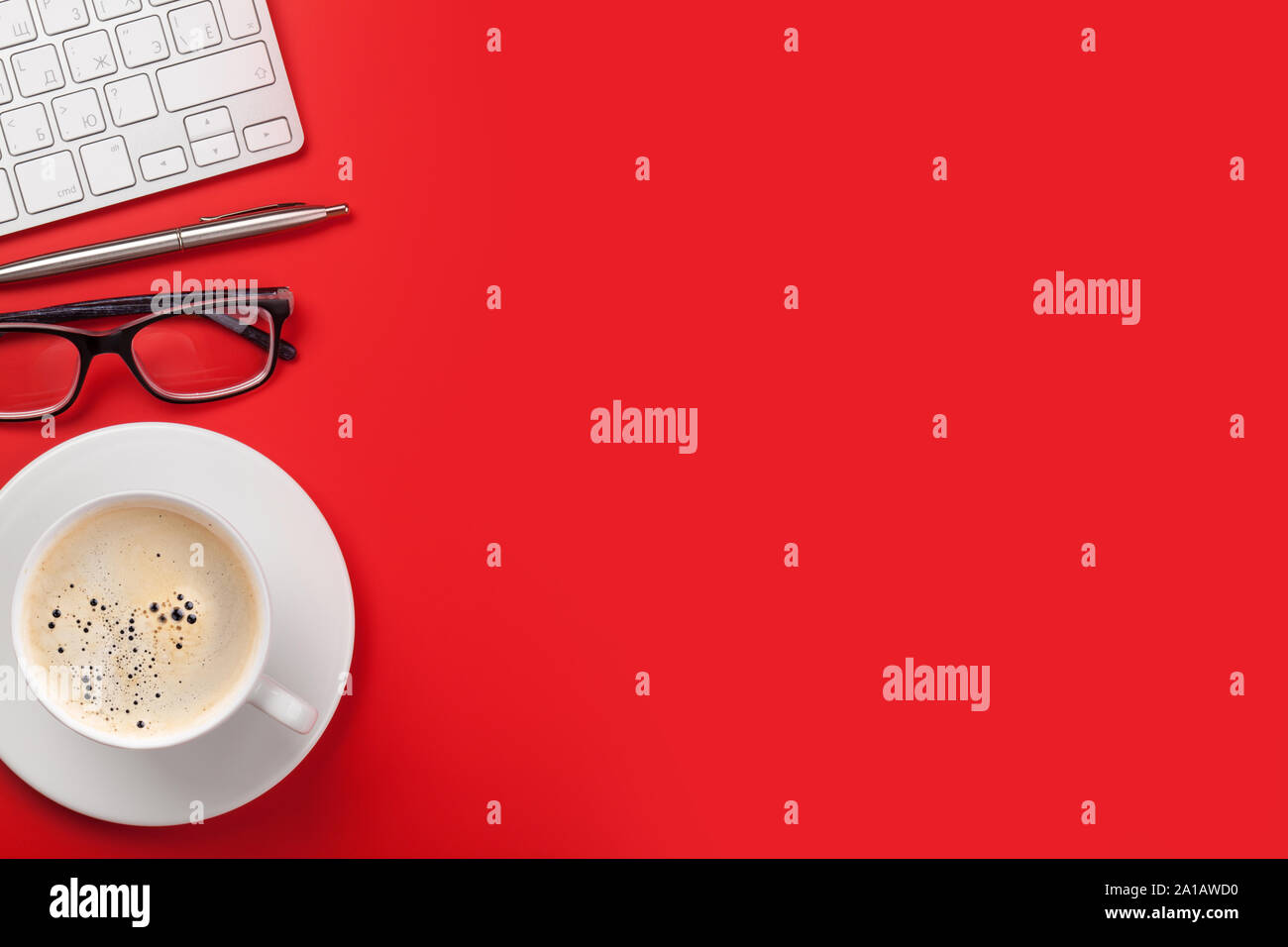 Office red workplace backdrop with coffee cup, supplies and computer ...