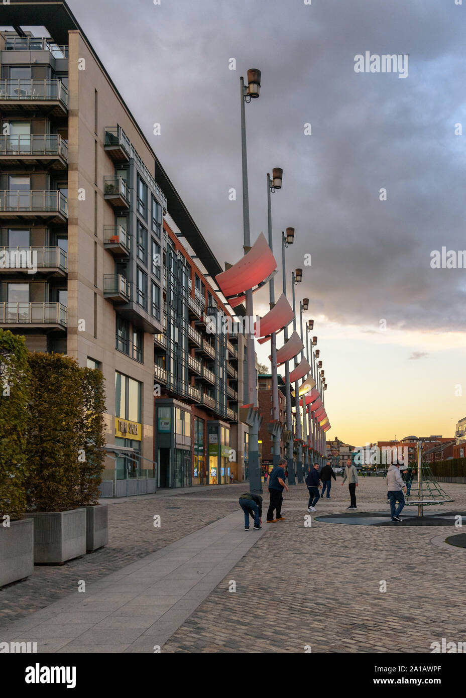 A row of apartment buildings and lamp posts at Smithfield Square in ...