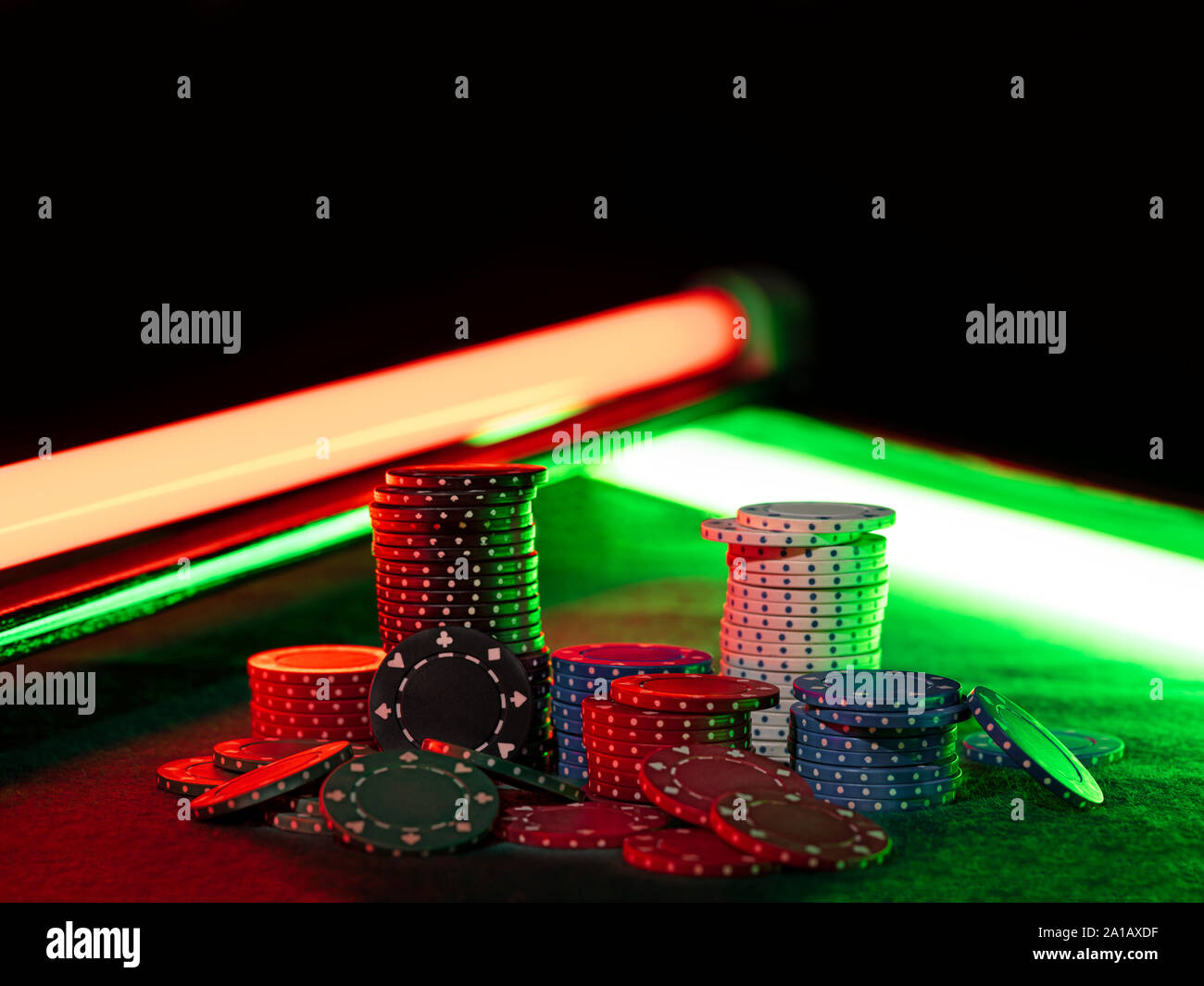 Close-up photo of a multicolored chips piles, some of them laying ...