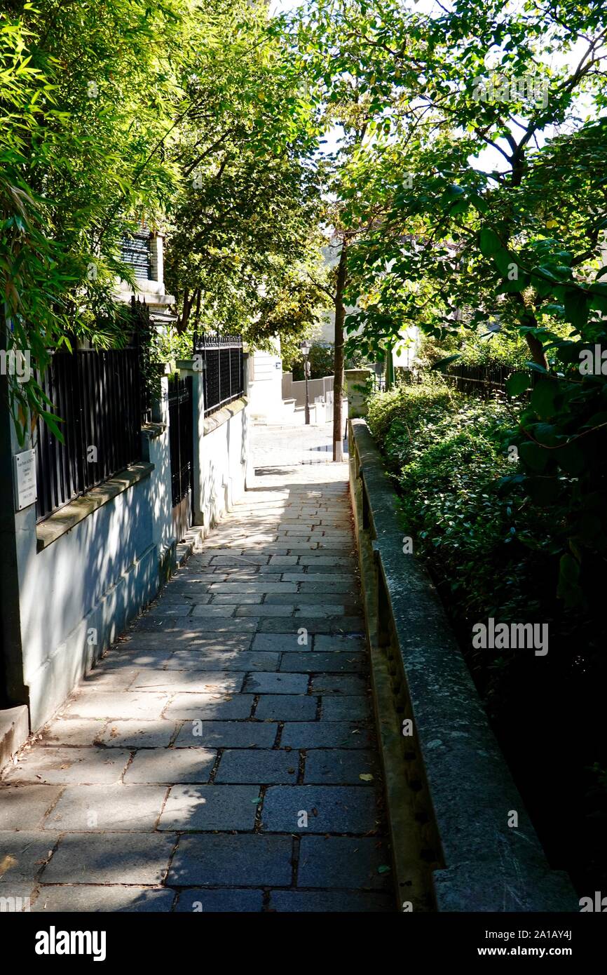 Empty Allée des Brouillards, an alleyway in the back streets of ...