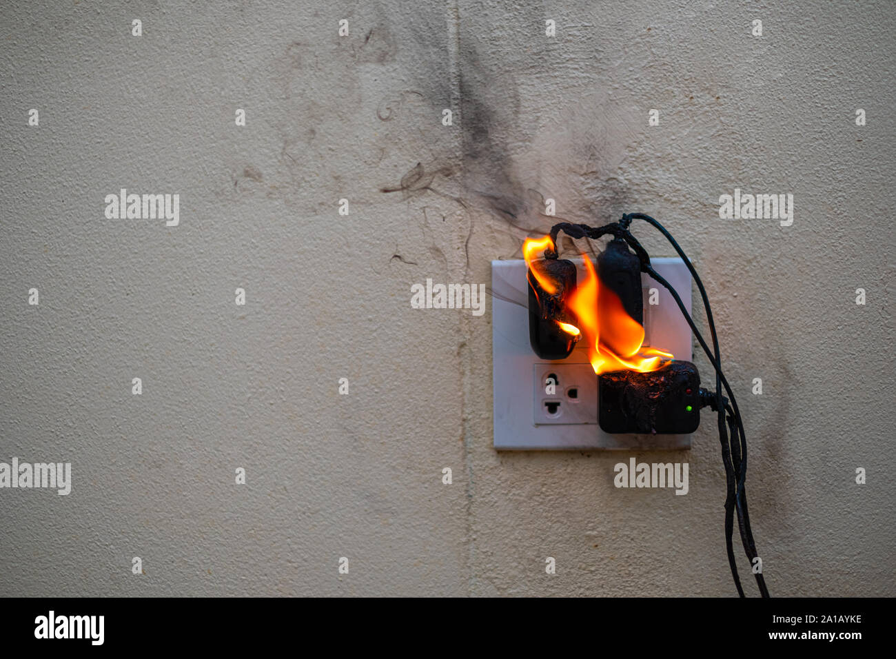 On fire adapter at plug Receptacle on white background, Electric short ...