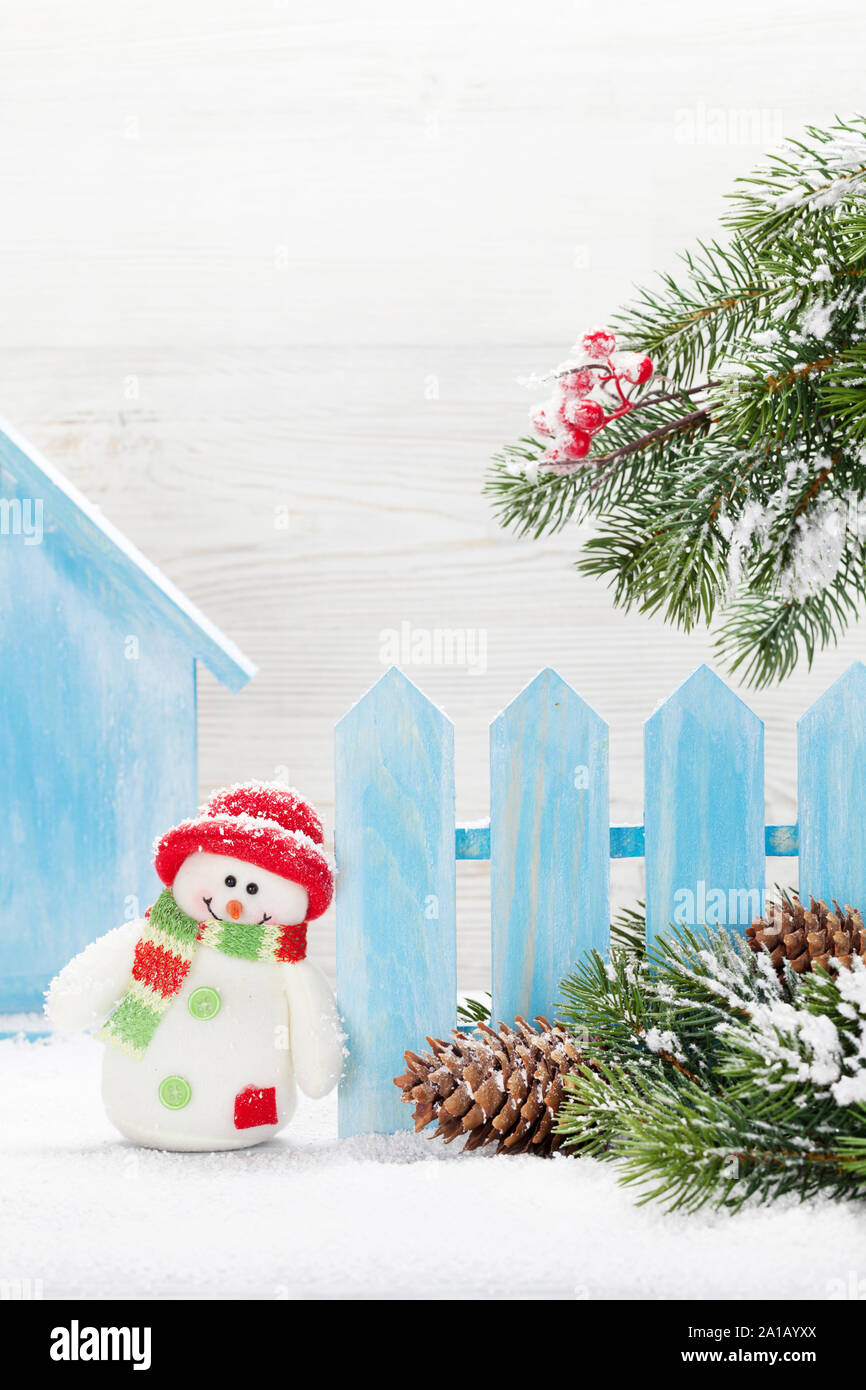 Christmas snowman toy, decor and fir tree branch. Xmas greeting card ...