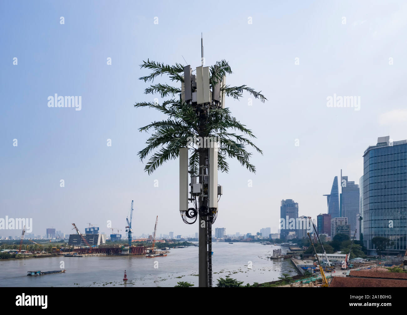 A mobile phone tower disguised as a palm tree with a steel pole as a ...